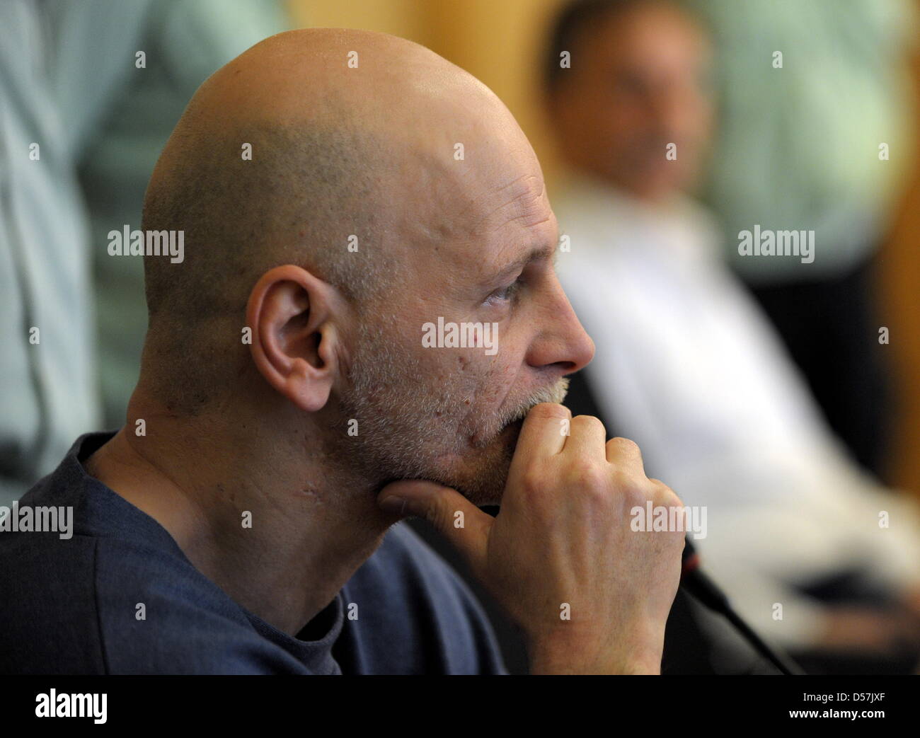 Defendants Peter Paul Michalski (front) and Michael Heckhoff sit in the ...