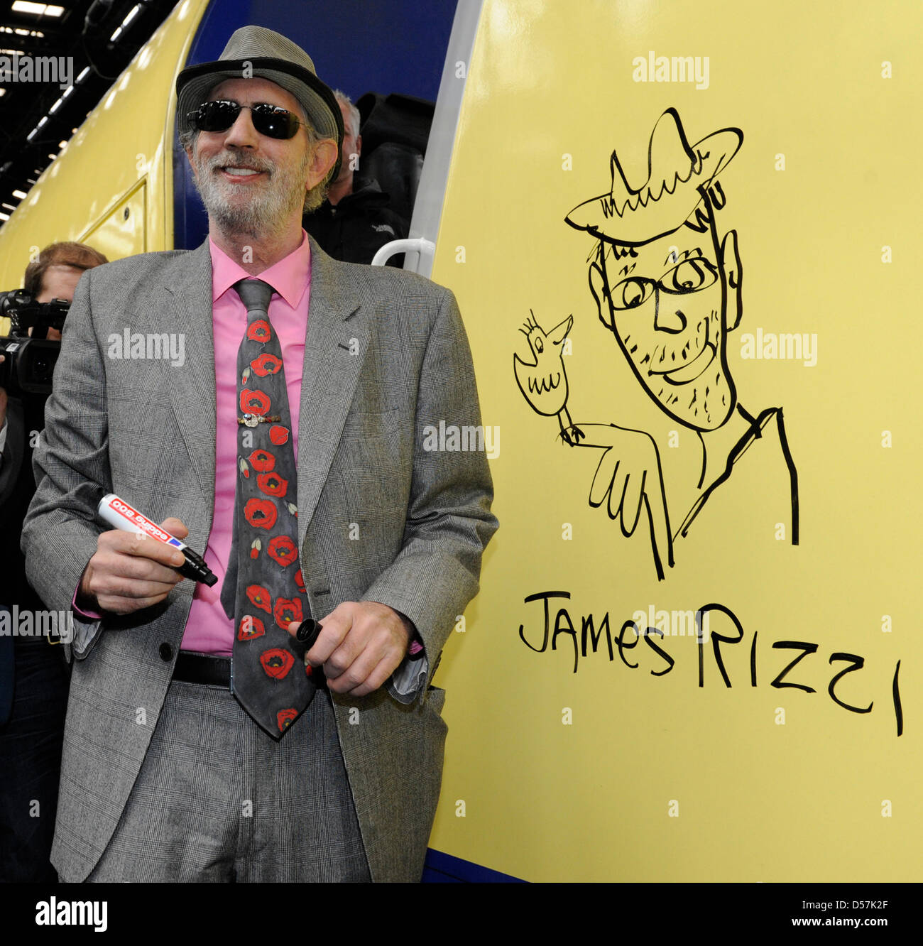 US pop art artist James Rizzi signs the so-called 'Rizzi locomotive' in ...