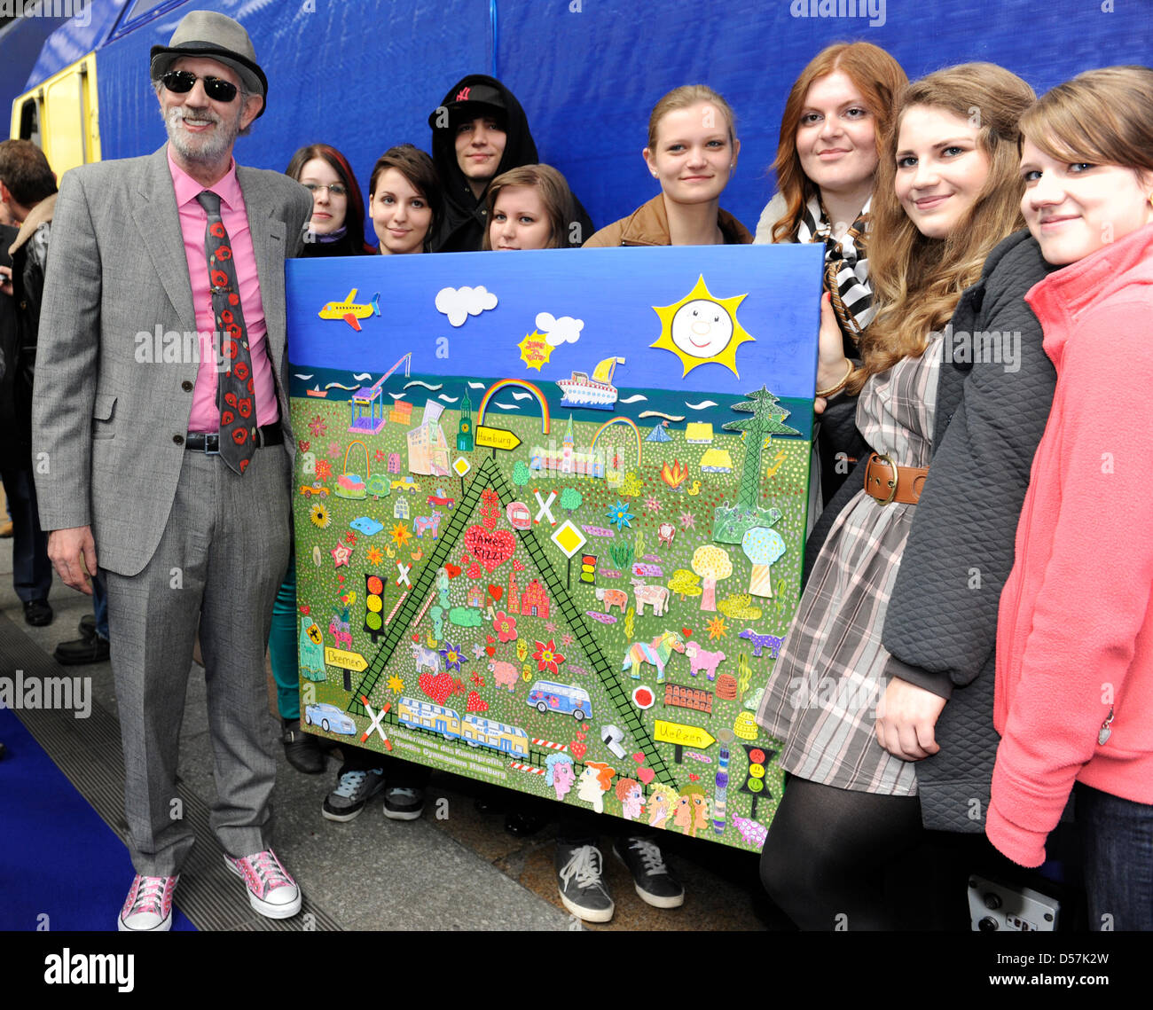 US pop art artist James Rizzi (L) smiles in front of the so-called ...