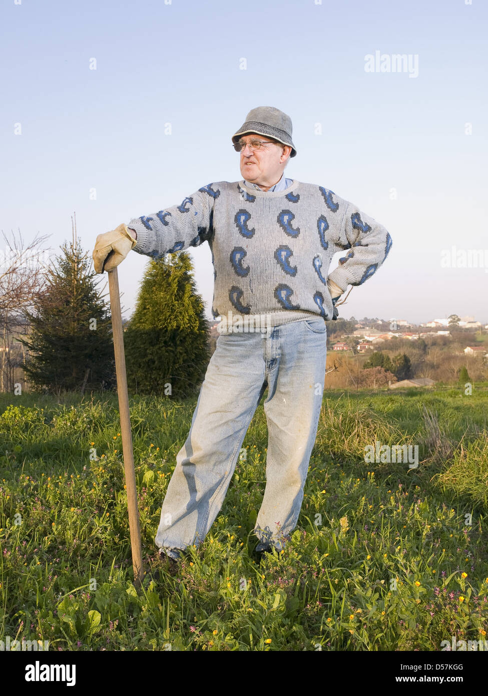 Man posing on their land farmer Stock Photo - Alamy