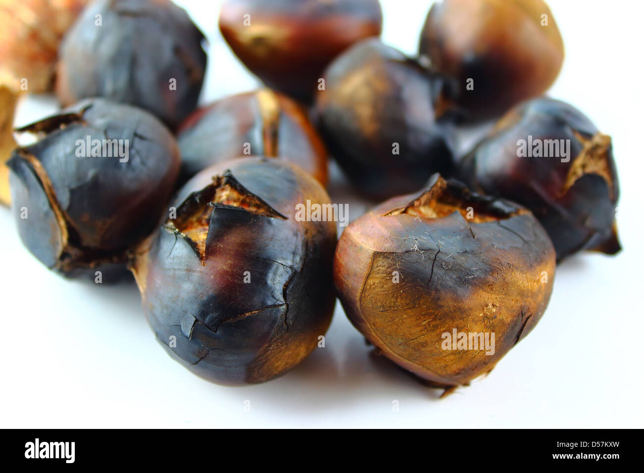 roasted sweet chestnuts on white background Stock Photo - Alamy