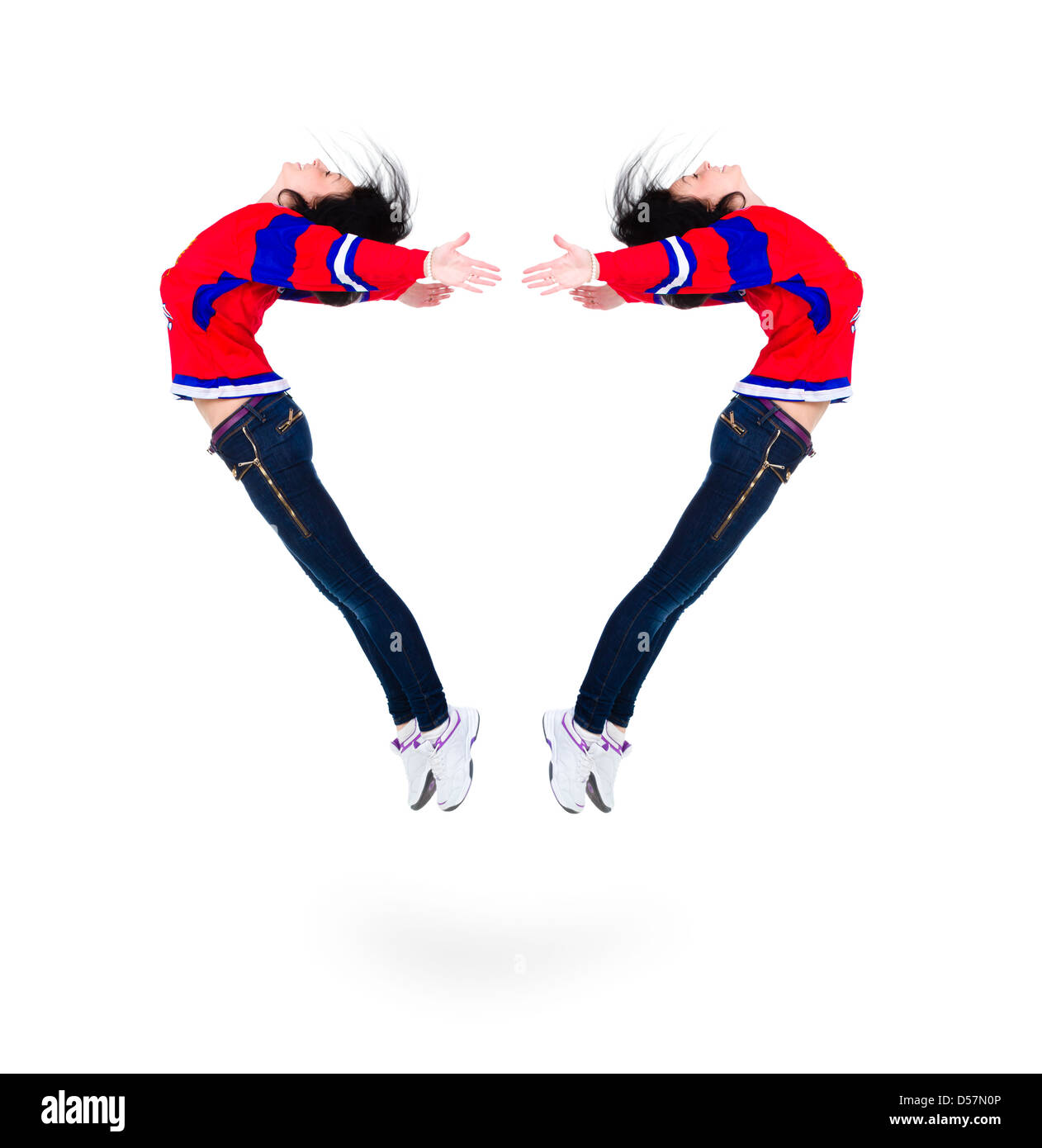 Jumping young woman forming a heart shape Stock Photo - Alamy