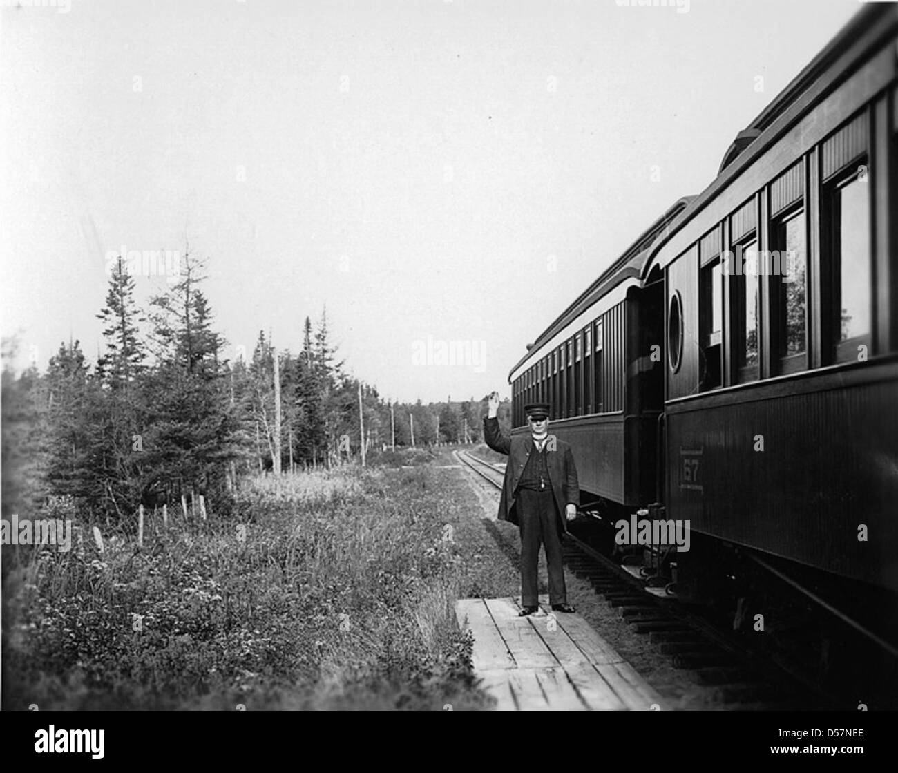 A historical image from 1915 showing passengers boarding a train at ...