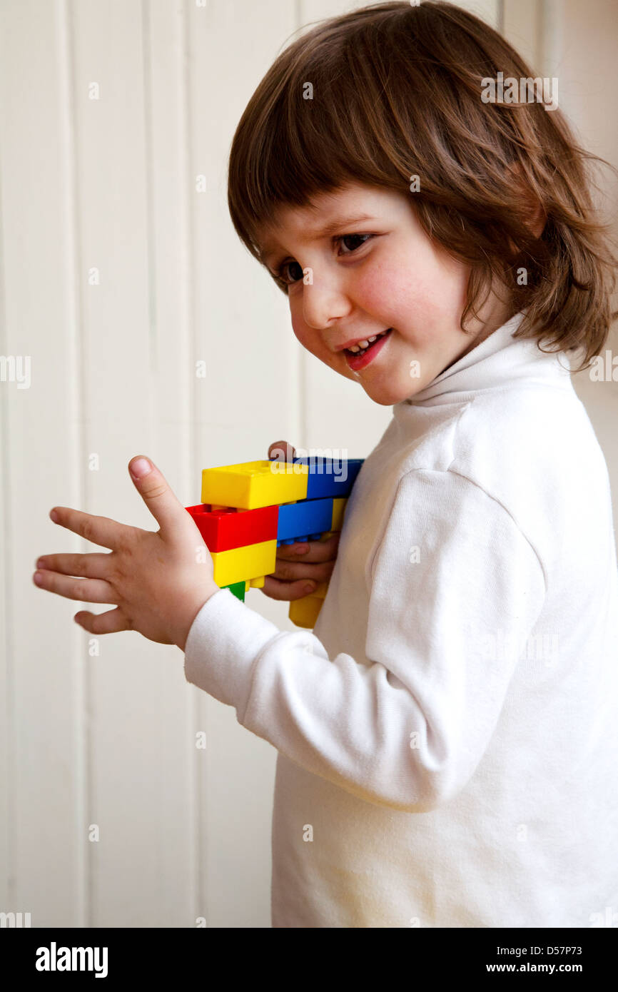 Four year old boy playing with Lego bricks Stock Photo - Alamy