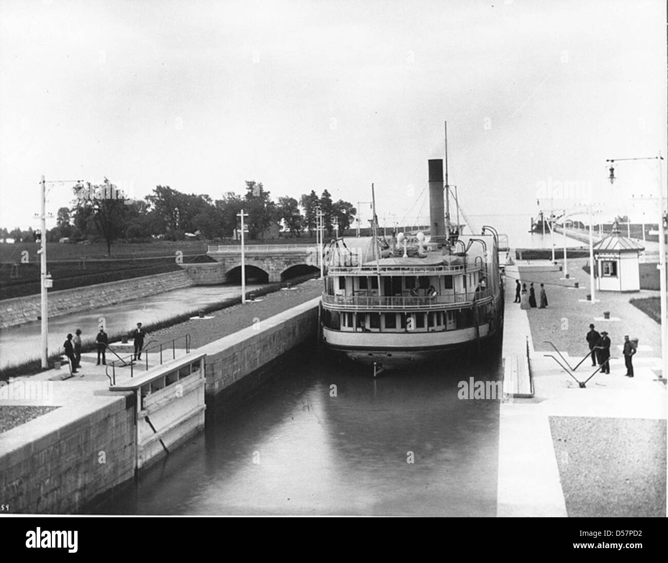 The S.S. Caspian, a steamboat, passes through the locks of the ...