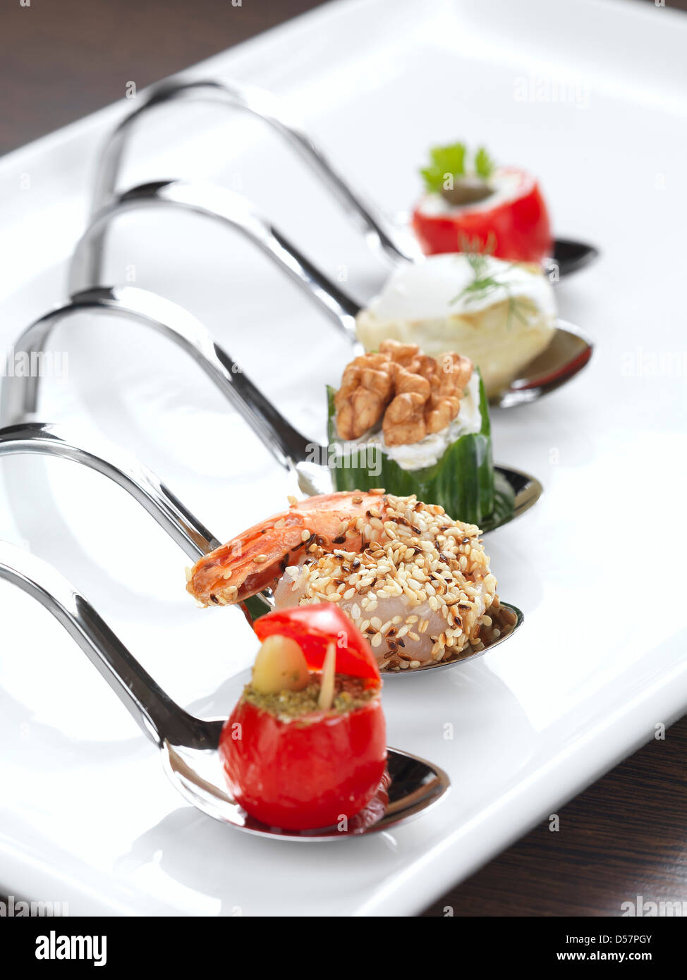 five different appetizers served in a modern style Stock Photo - Alamy