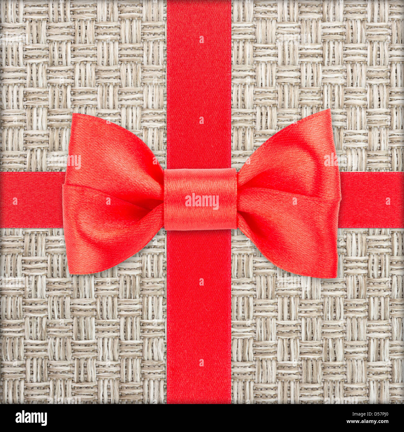 Red bow and ribbon over wrapped gift Stock Photo - Alamy
