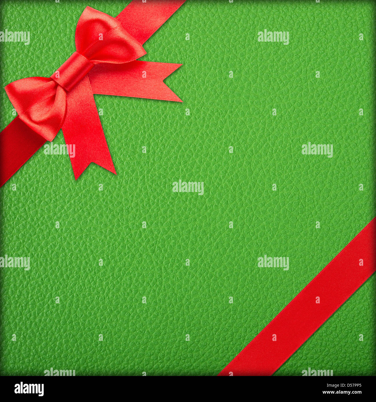 red bow and ribbon over red wrapped gift Stock Photo - Alamy