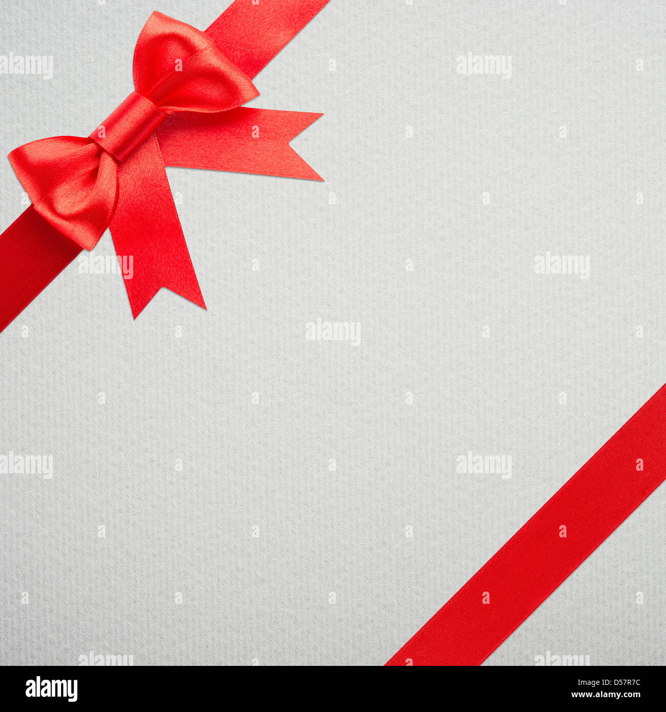 red bow and ribbon over wrapped gift Stock Photo - Alamy