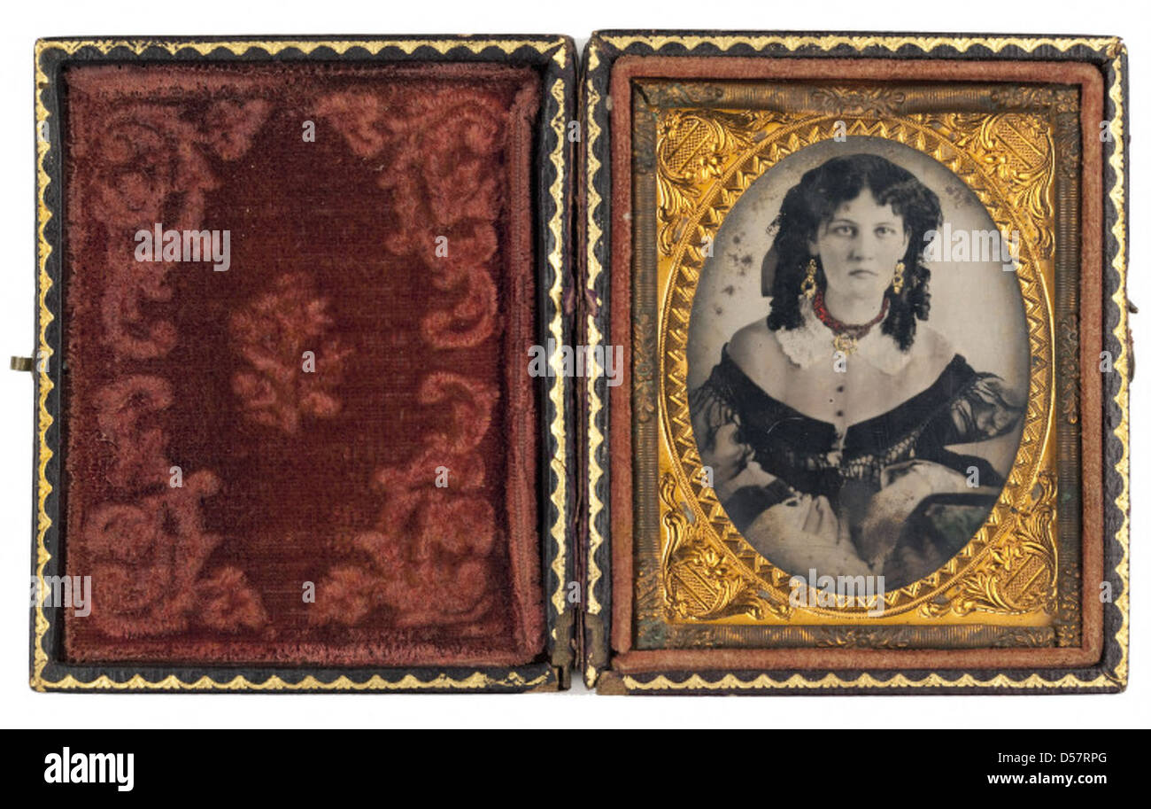 This image shows a young woman from 1868 wearing intricately tinted ...