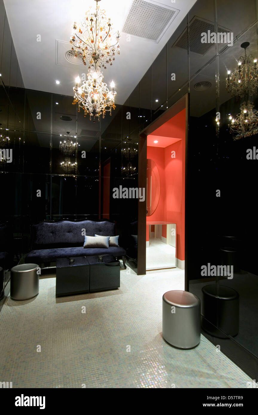 Lounge area with crystal chandelier Stock Photo - Alamy