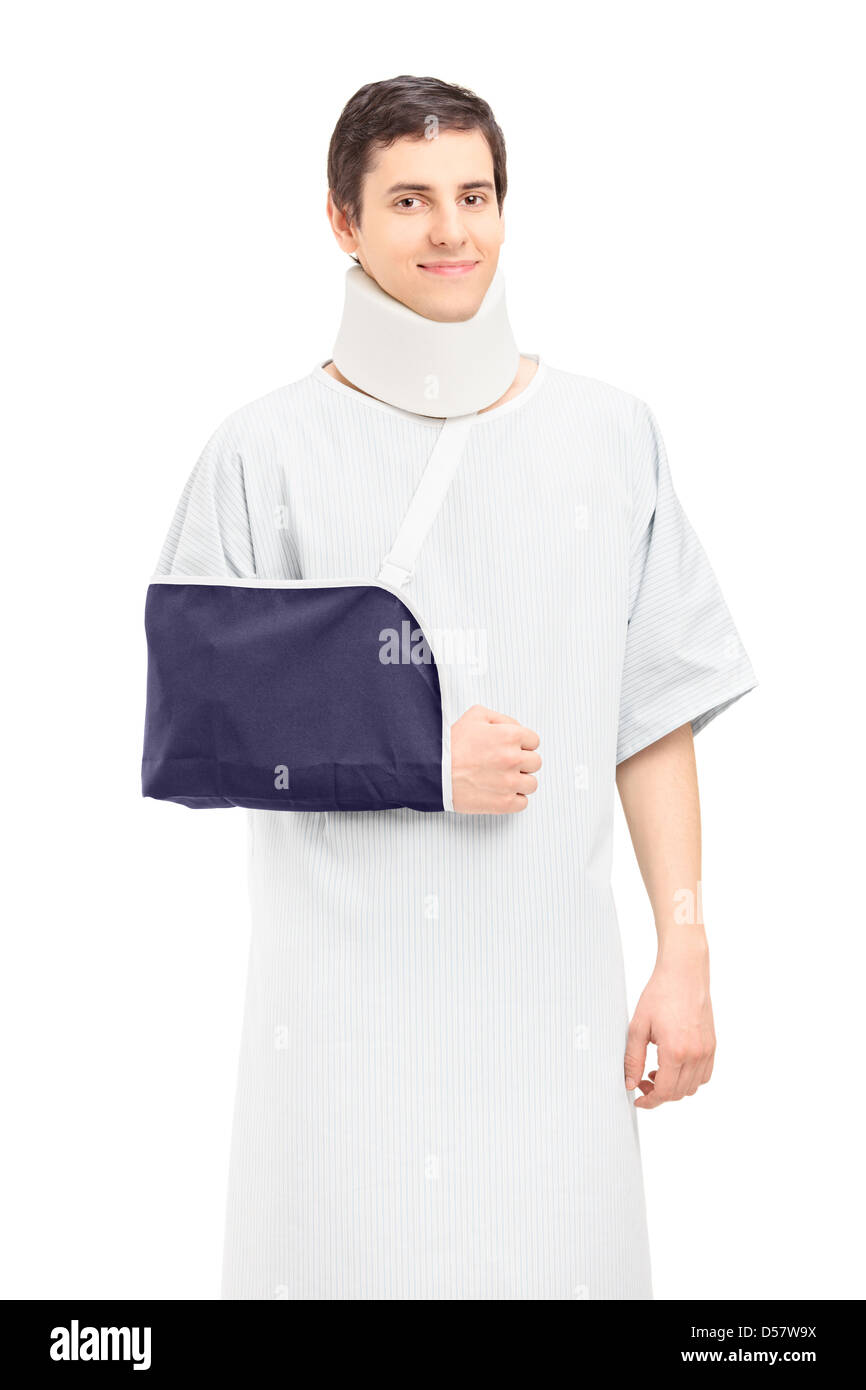 A male patient with a broken arm and neck posing isolated on white ...