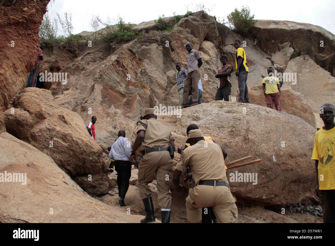 Police moving to scene where rock collapsed killing two stone miners ...