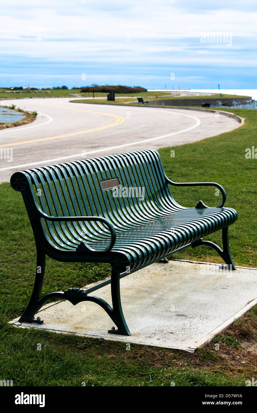 Bench along the side of the road Stock Photo - Alamy