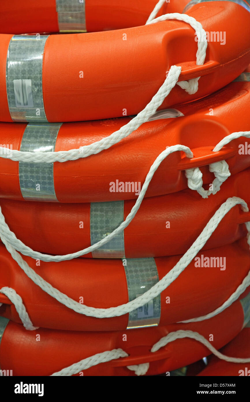 piles of Orange life preserver for help to people in danger of drowning ...