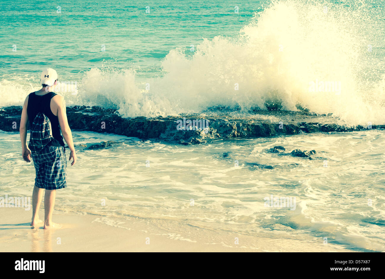 Man looking at waves Stock Photo - Alamy
