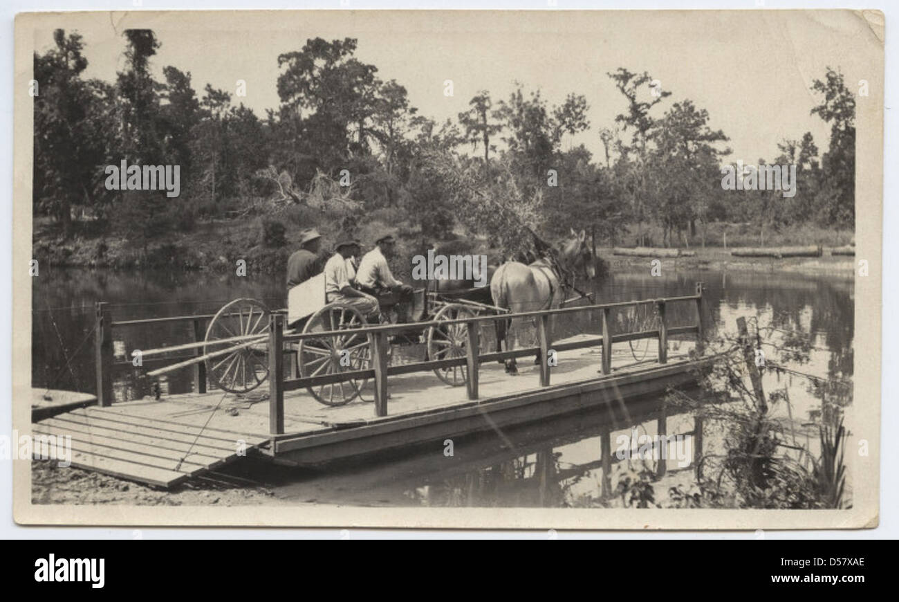 A historical photograph showing U.S. Geological Survey (USGS) surveyors ...