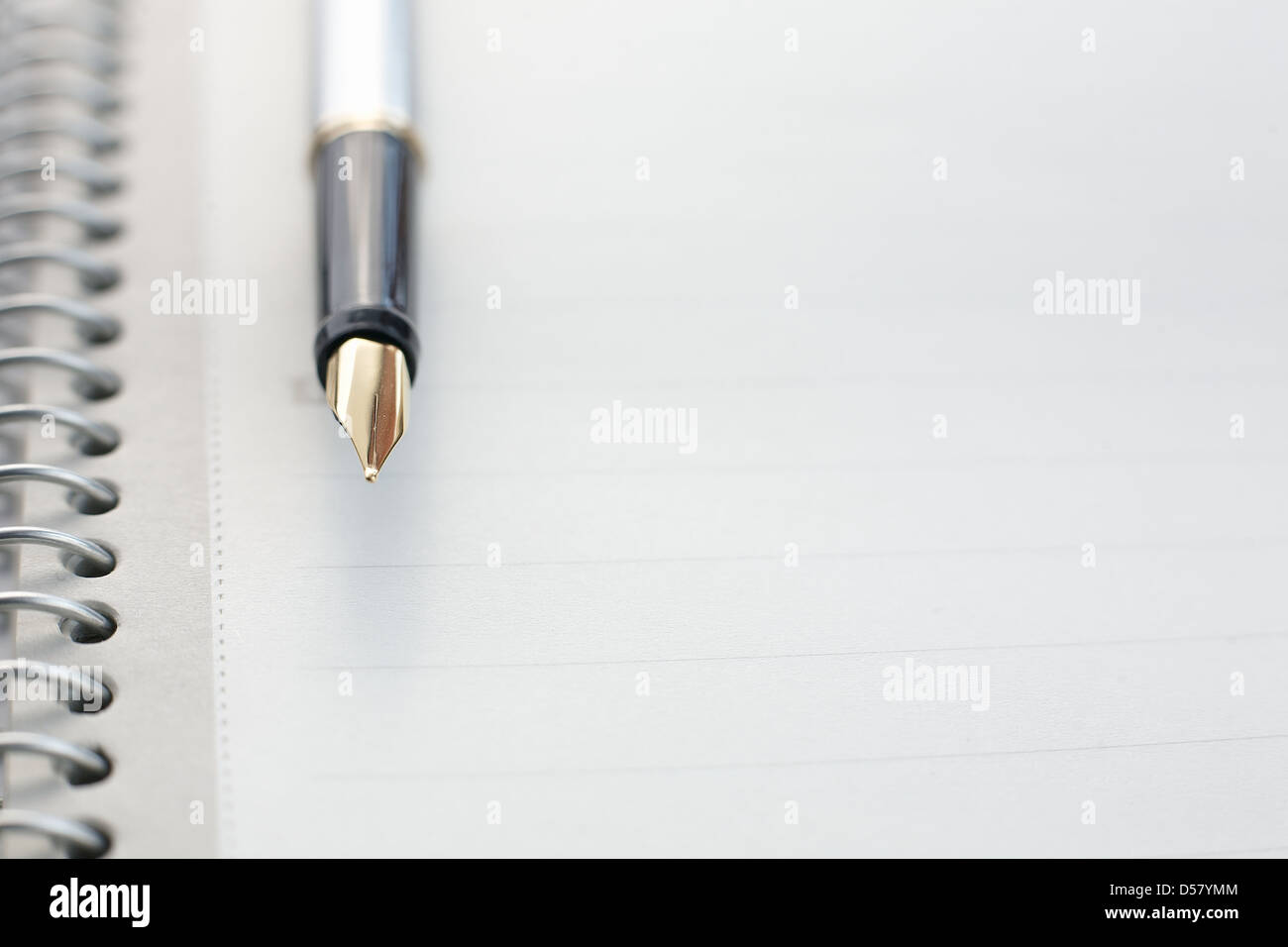Pen and notebook Stock Photo - Alamy