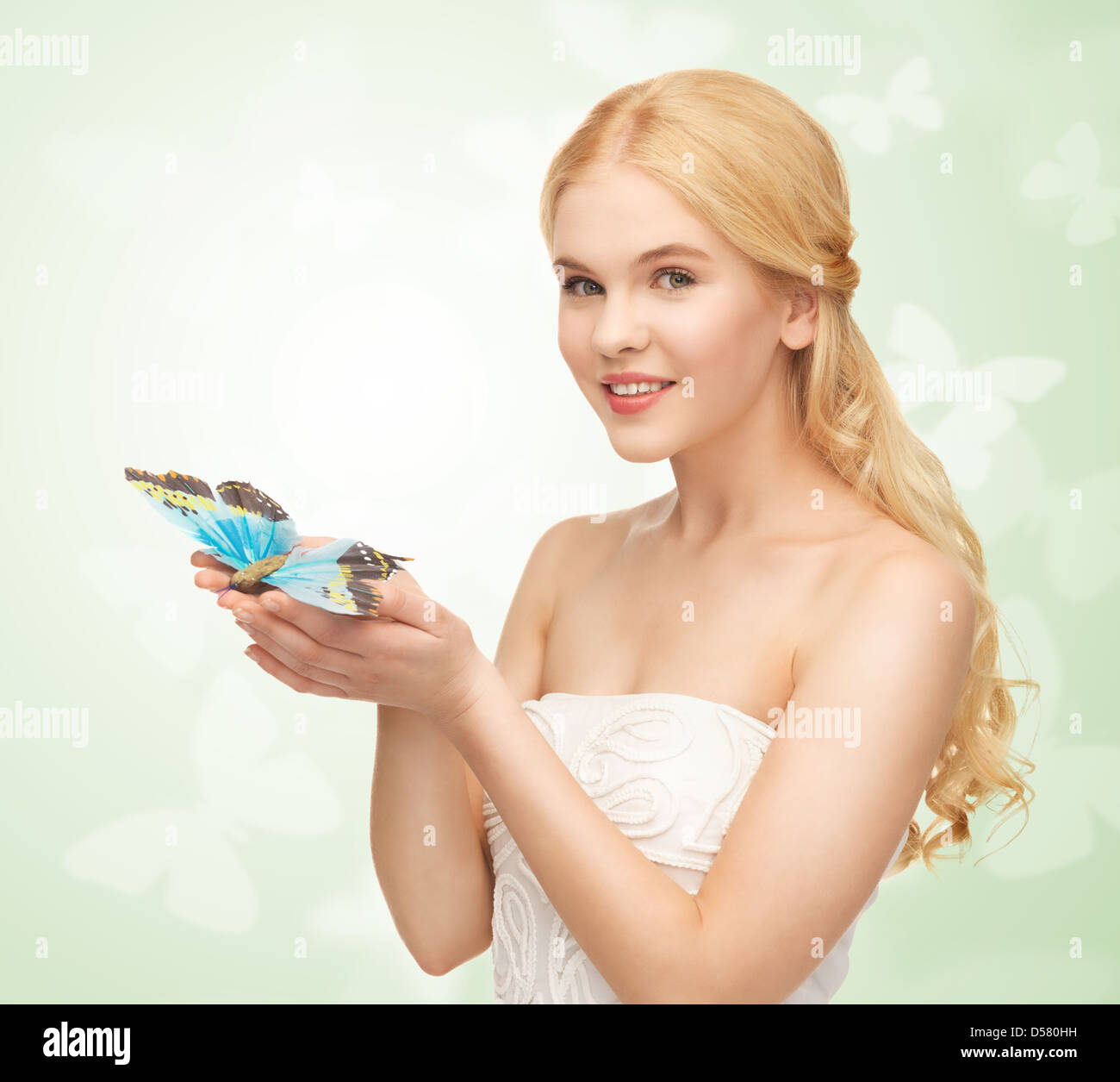 woman with butterfly in hand Stock Photo - Alamy