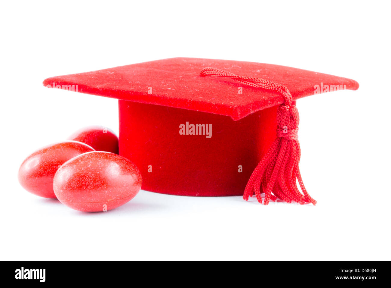 Graduation red hat Stock Photo - Alamy