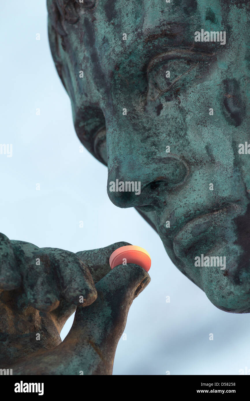 Ancient sculpture with glowing curative pill in its hand Stock Photo ...