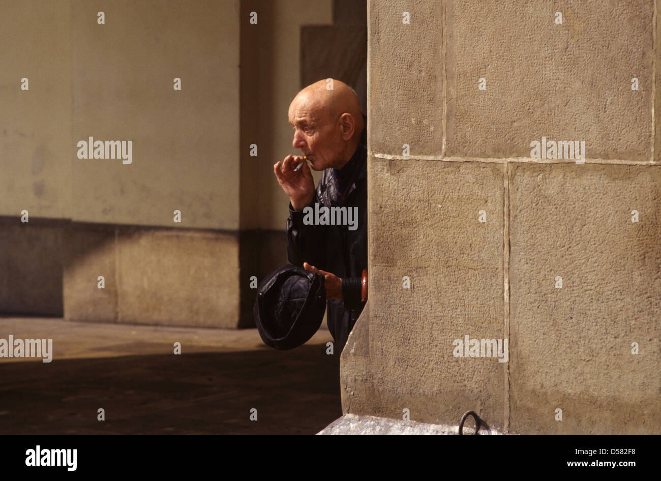 Old man smoking a cigarette in krakow Poland Stock Photo - Alamy