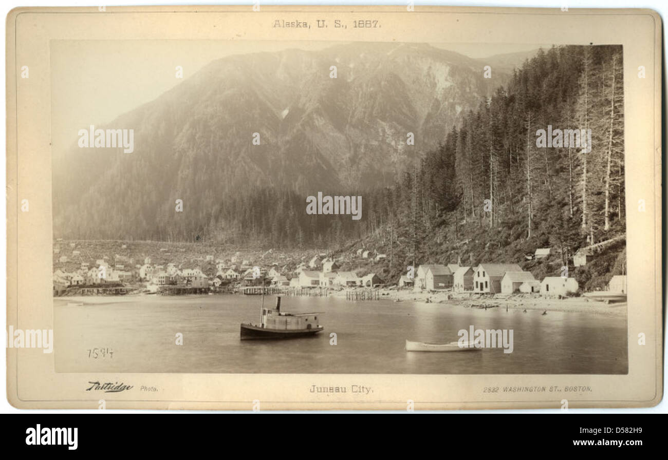 A photograph of Juneau City in Alaska, showing the scenic town nestled ...