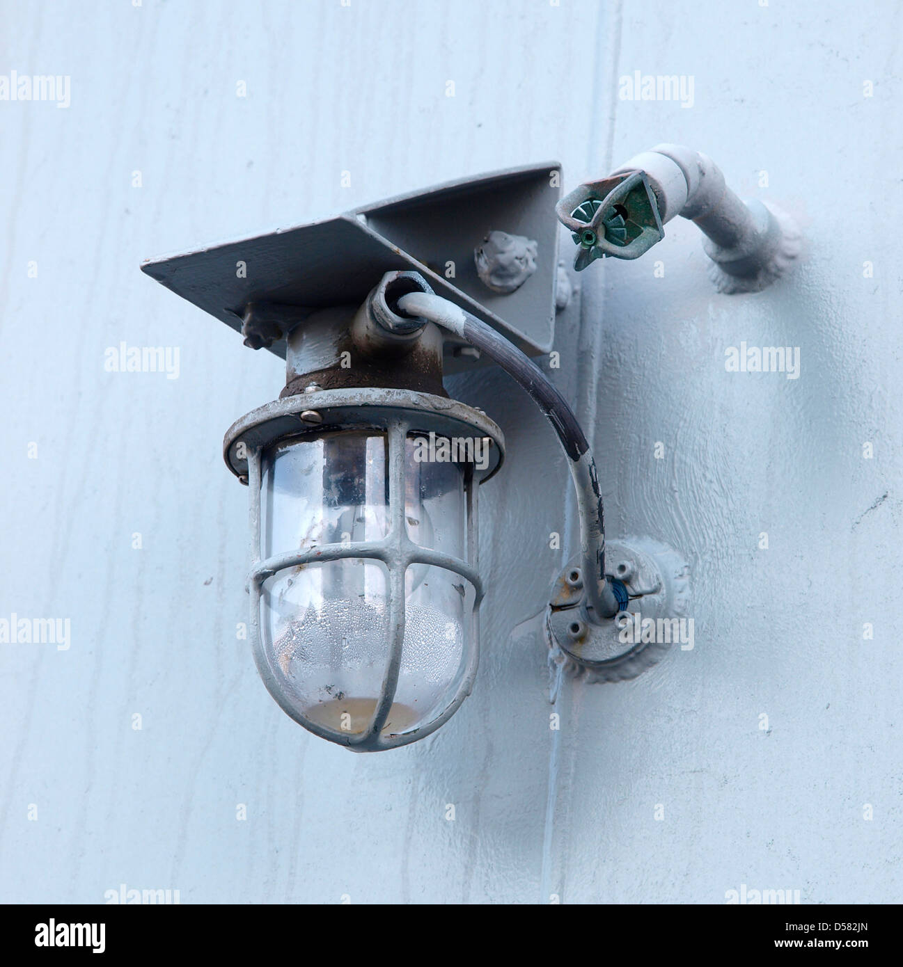 Wall lamp detail in square composition. This wall lamp is located on a ...