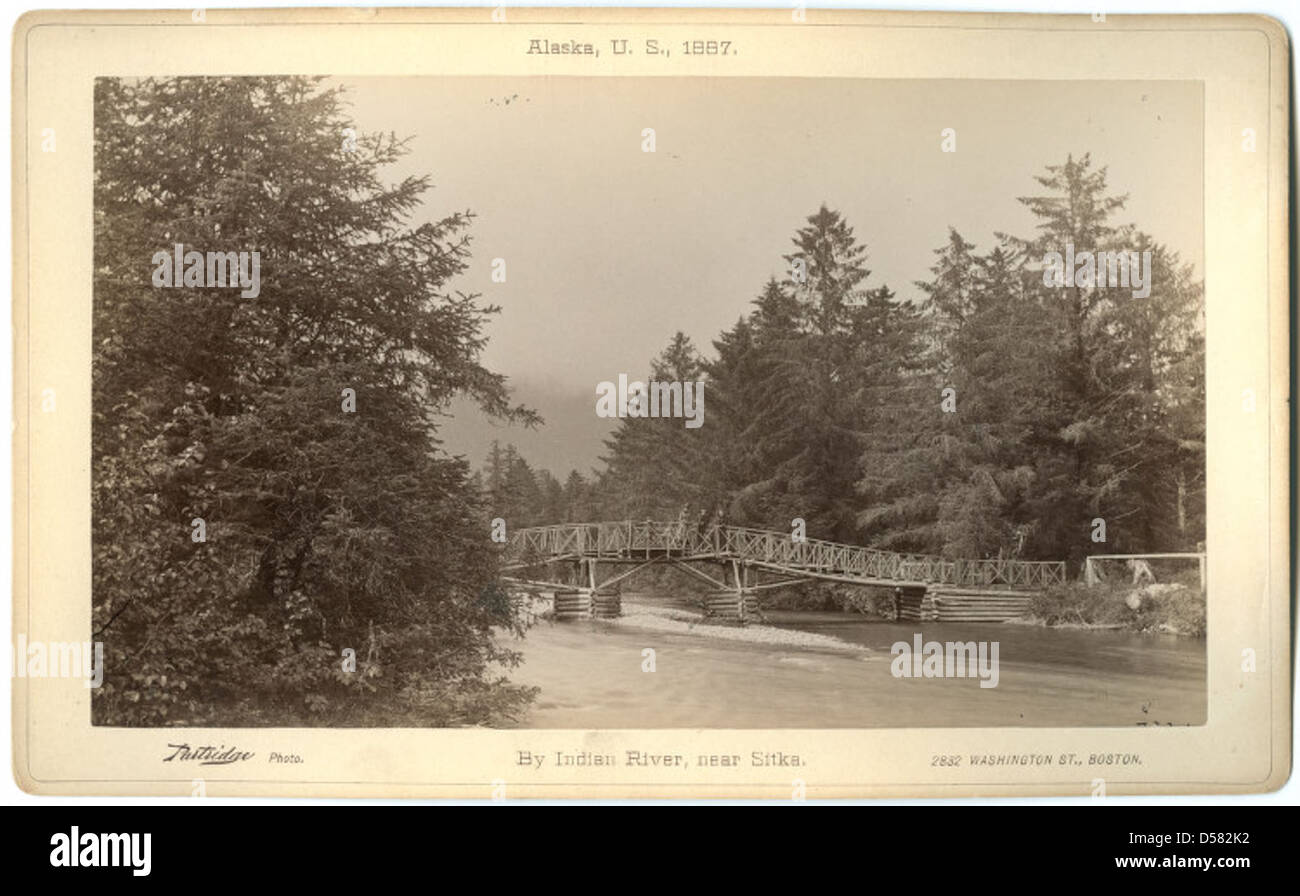 A scenic view of the Indian River near Sitka, Alaska, featuring lush ...
