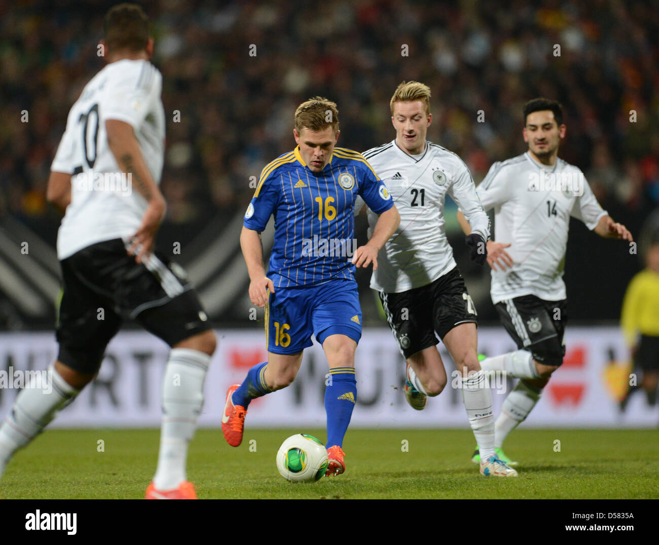 Germany's Marco Reus (2-R) and Kazakhstan's Genrikh Shmidtgal (2-L) vie ...