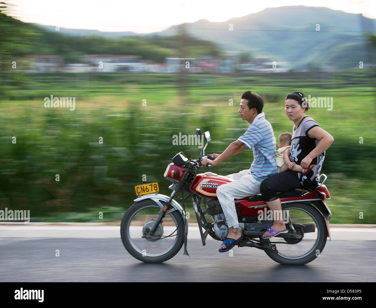 Family on a motor bike hi-res stock photography and images - Alamy