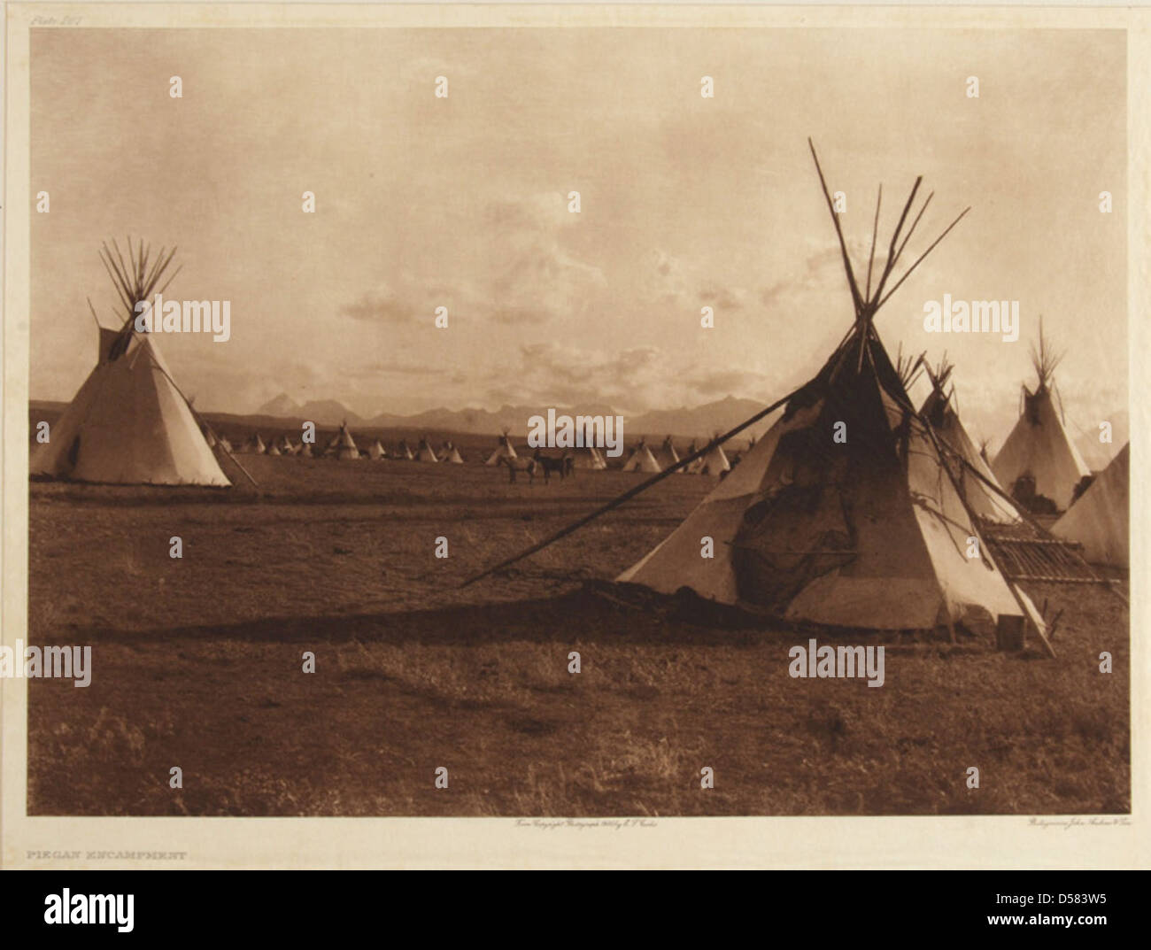 A photograph from 1900 showing a Piegan Indian encampment in Canada ...