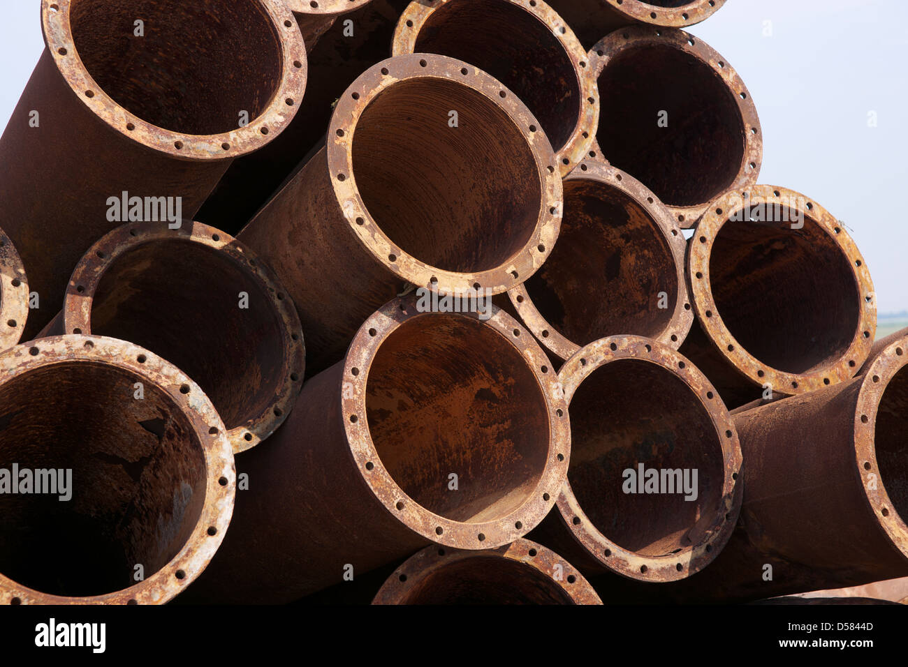 Stack of rusty metal piping used for tidal sediment diversion near ...