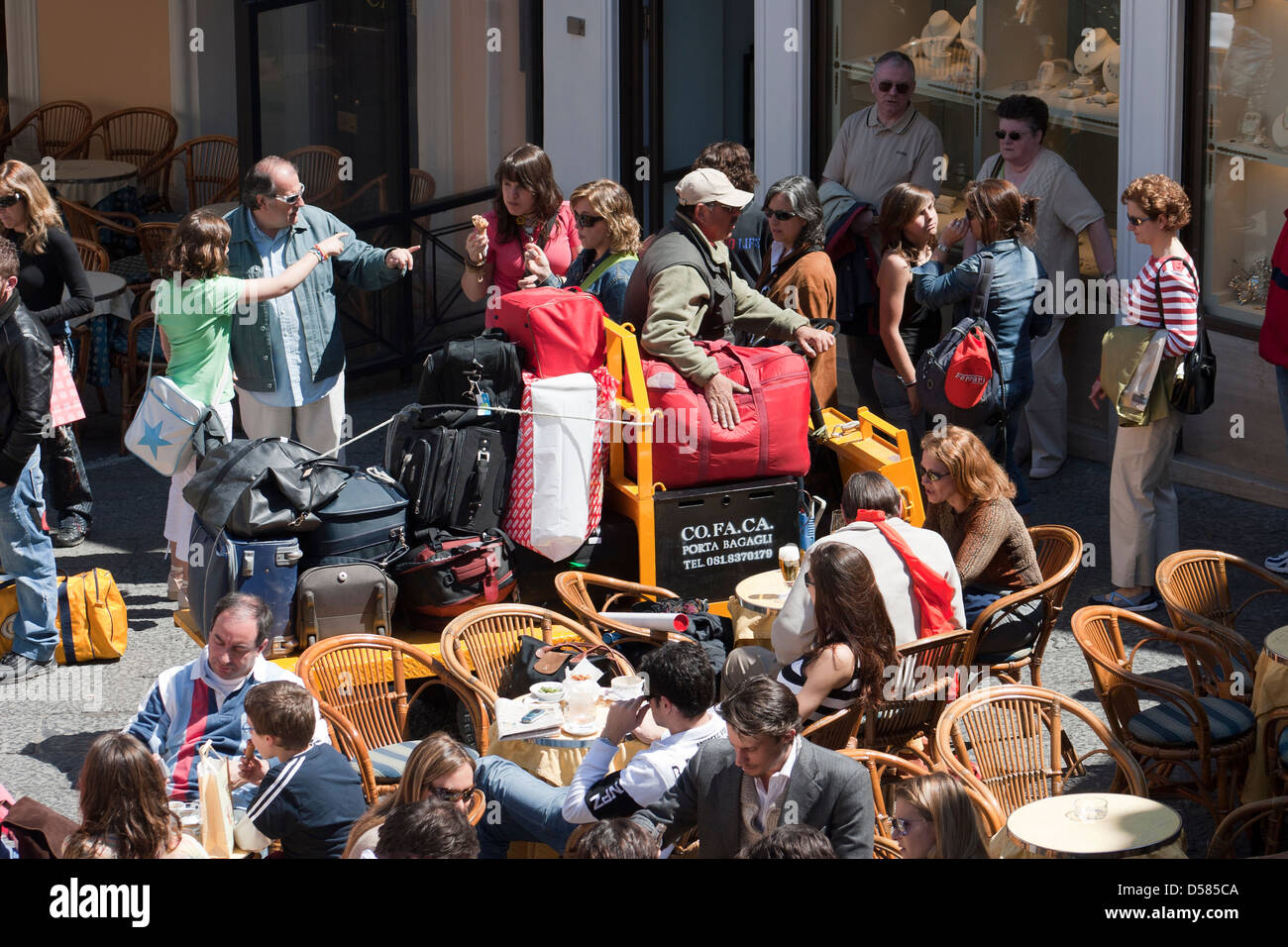 Baggage Porter makes his way through Crowded Piazza on the Island of ...