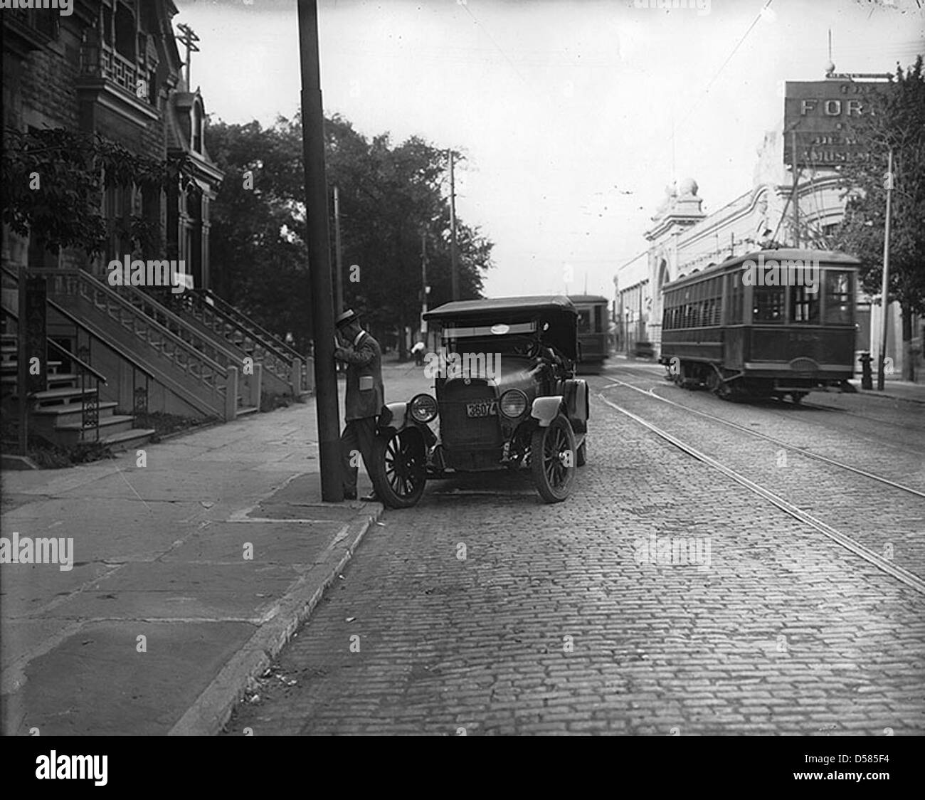 A 1920s Studebaker convertible automobile parked on Ste. Catherine St ...