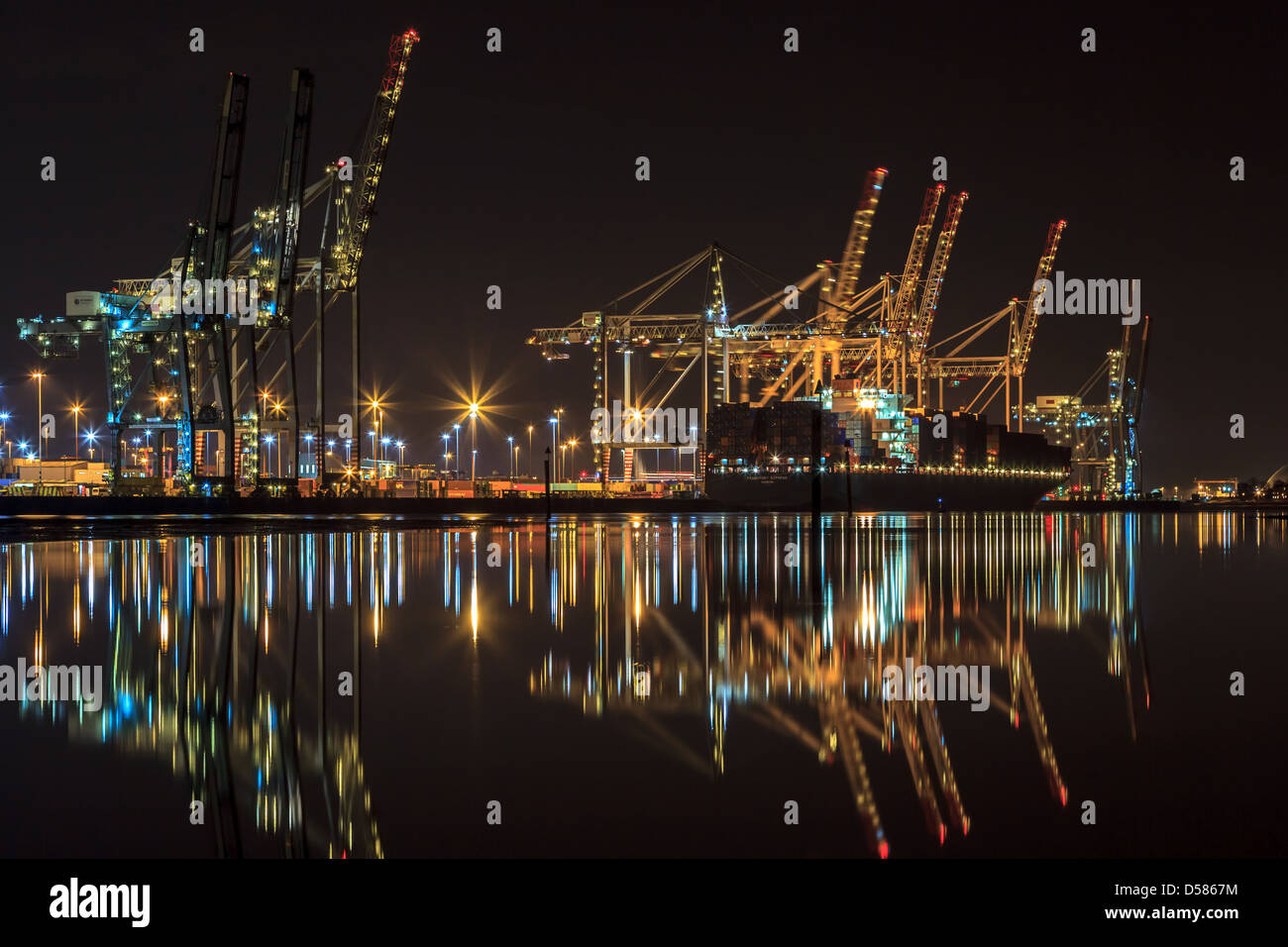 Southampton docks at night with the container ship, Frankfurt Express ...