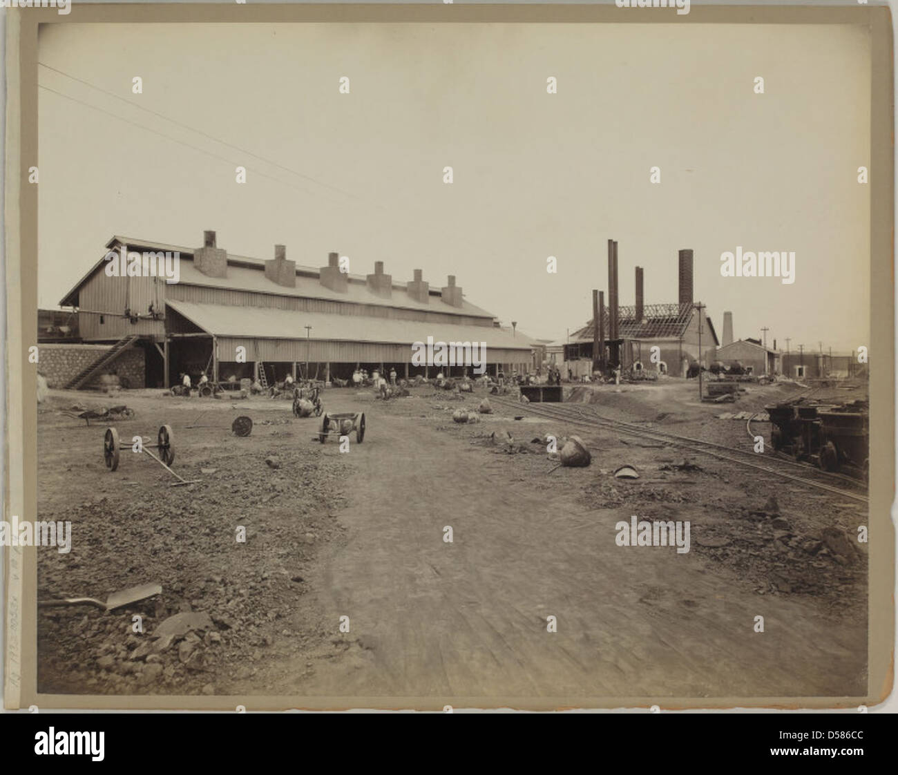 An image showing Smelter No. 2 along with railroad tracks, workers, and ...