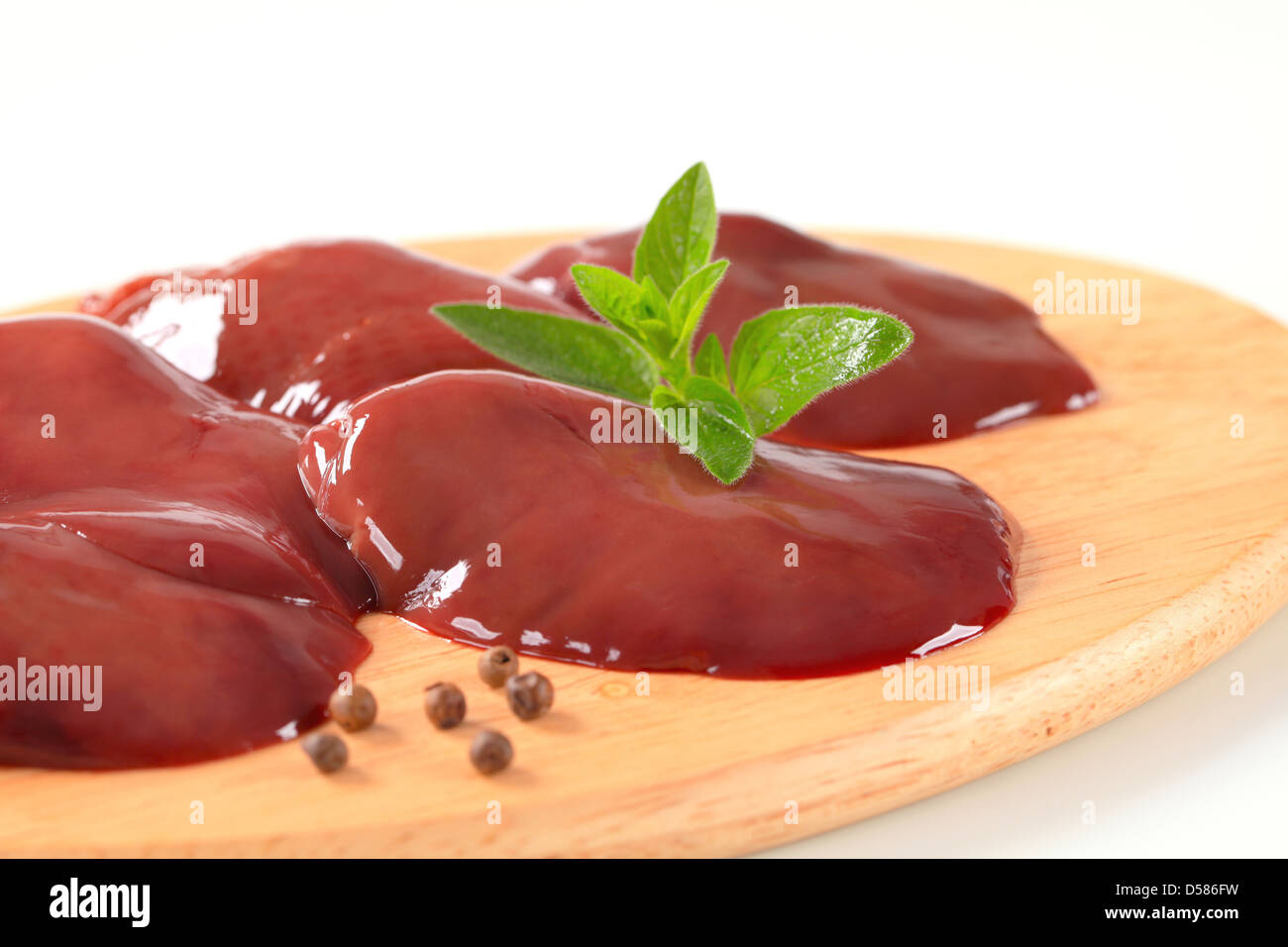 Raw chicken liver on cutting board Stock Photo - Alamy