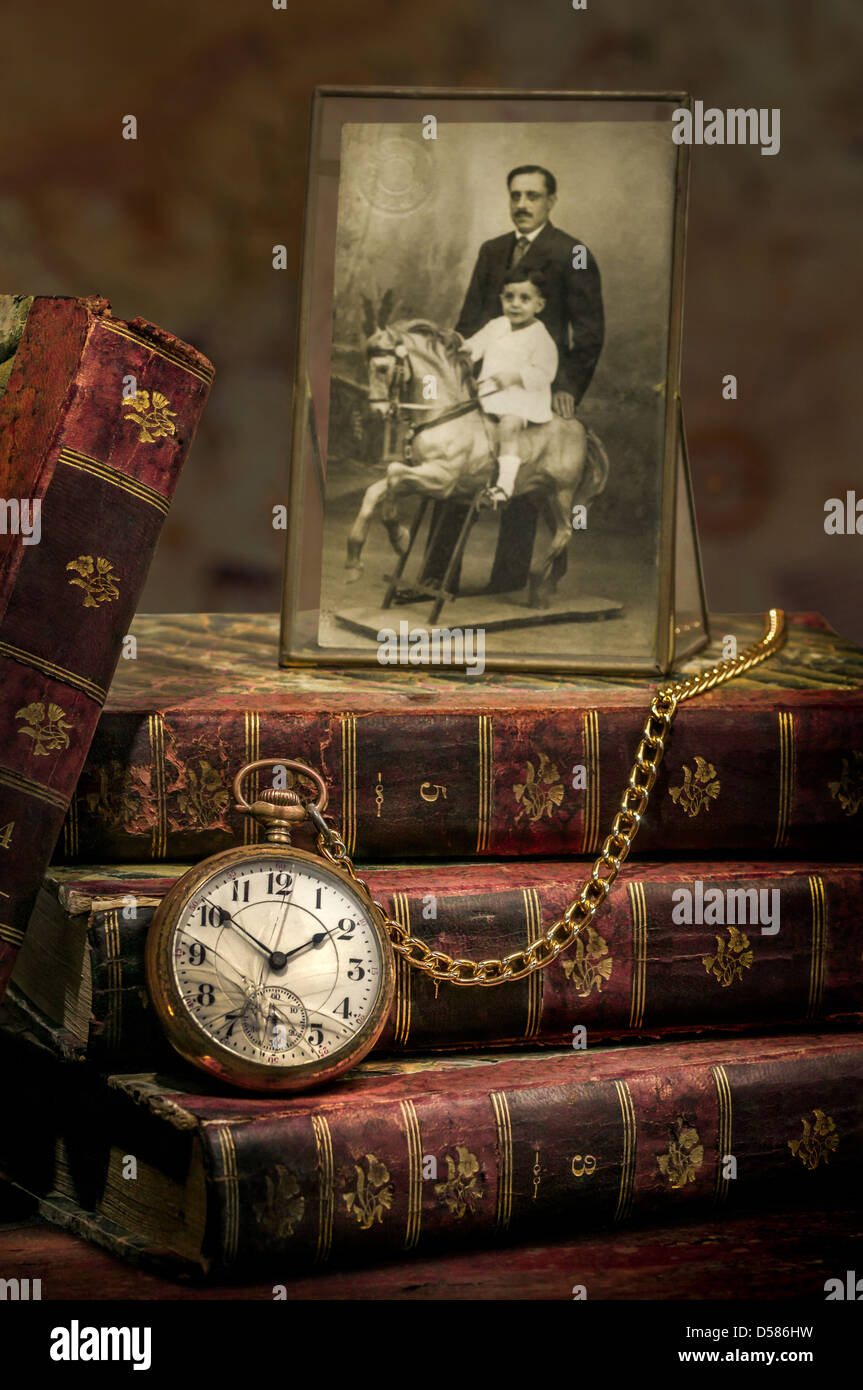 Grandfather photo, pocket watch and books in Low-key Stock Photo - Alamy