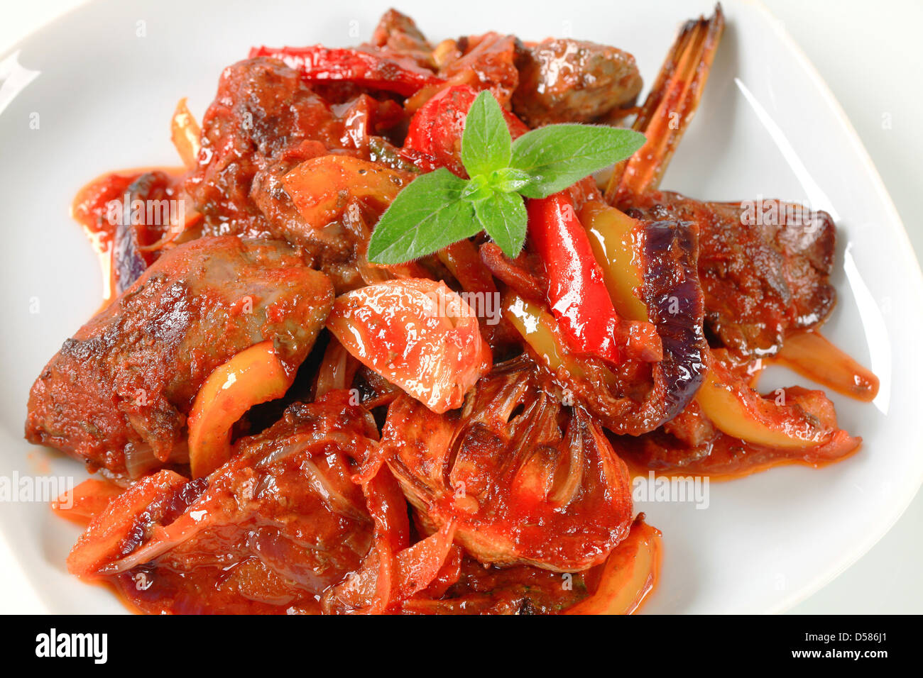 Chicken liver and bell pepper stir fry Stock Photo - Alamy