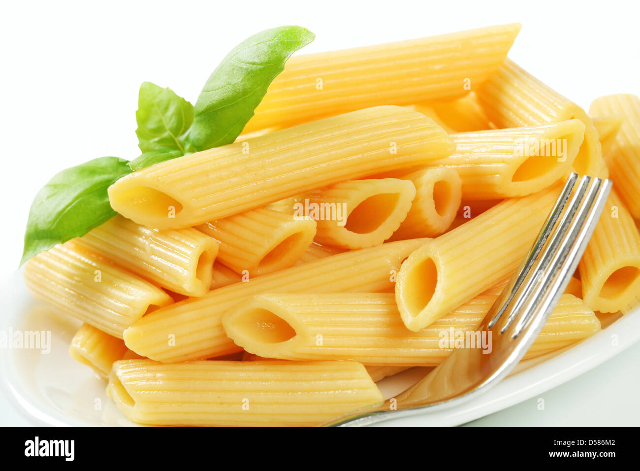 Portion of cooked penne pasta Stock Photo - Alamy
