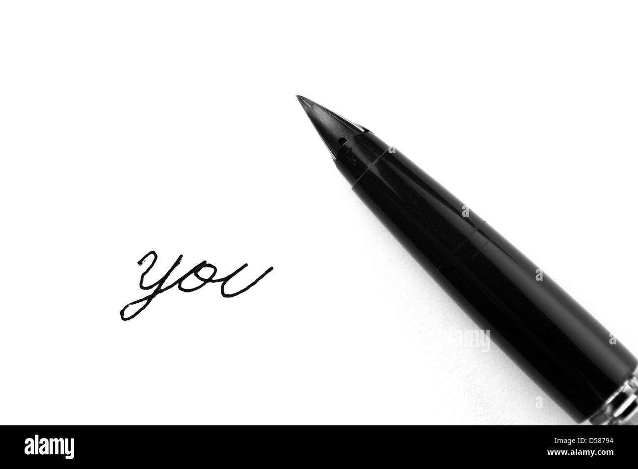 Antique fountain pen writing the word YOU Stock Photo - Alamy