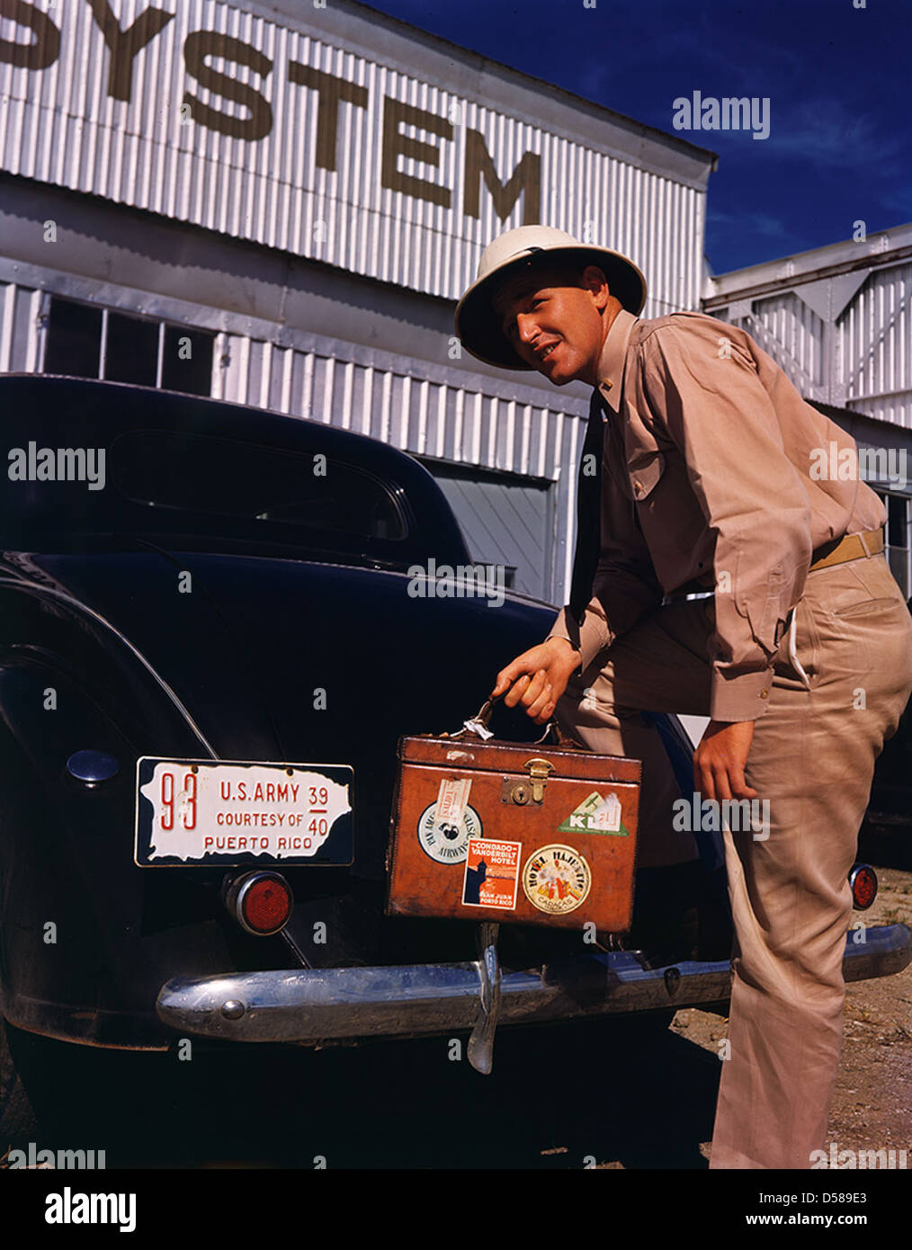 This photograph shows an army soldier with luggage in Puerto Rico. The ...