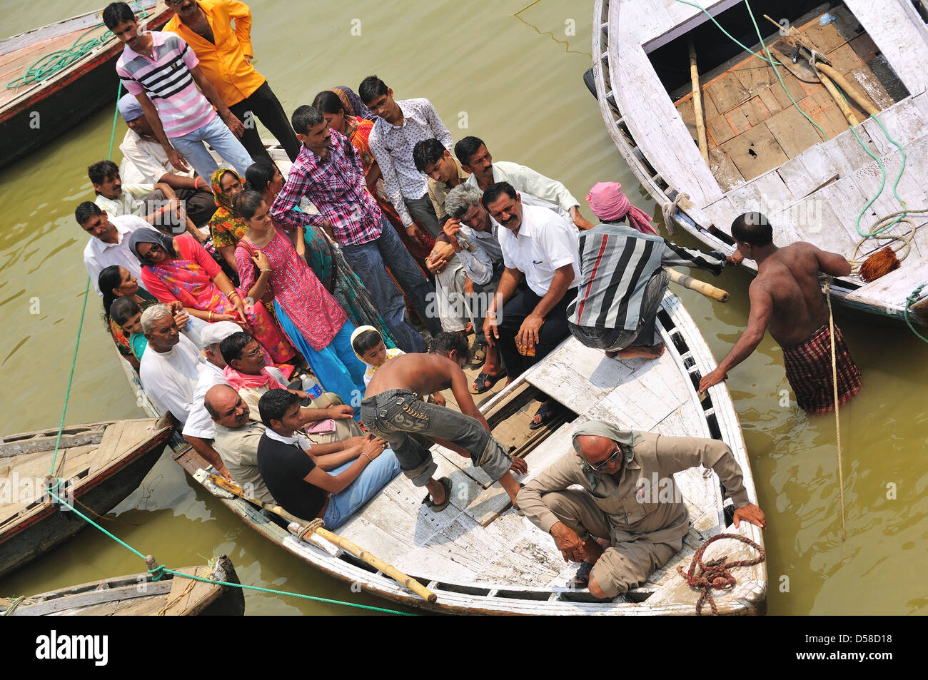 Pilgrims on the boat at Ganges river in Varanasi Stock Photo - Alamy