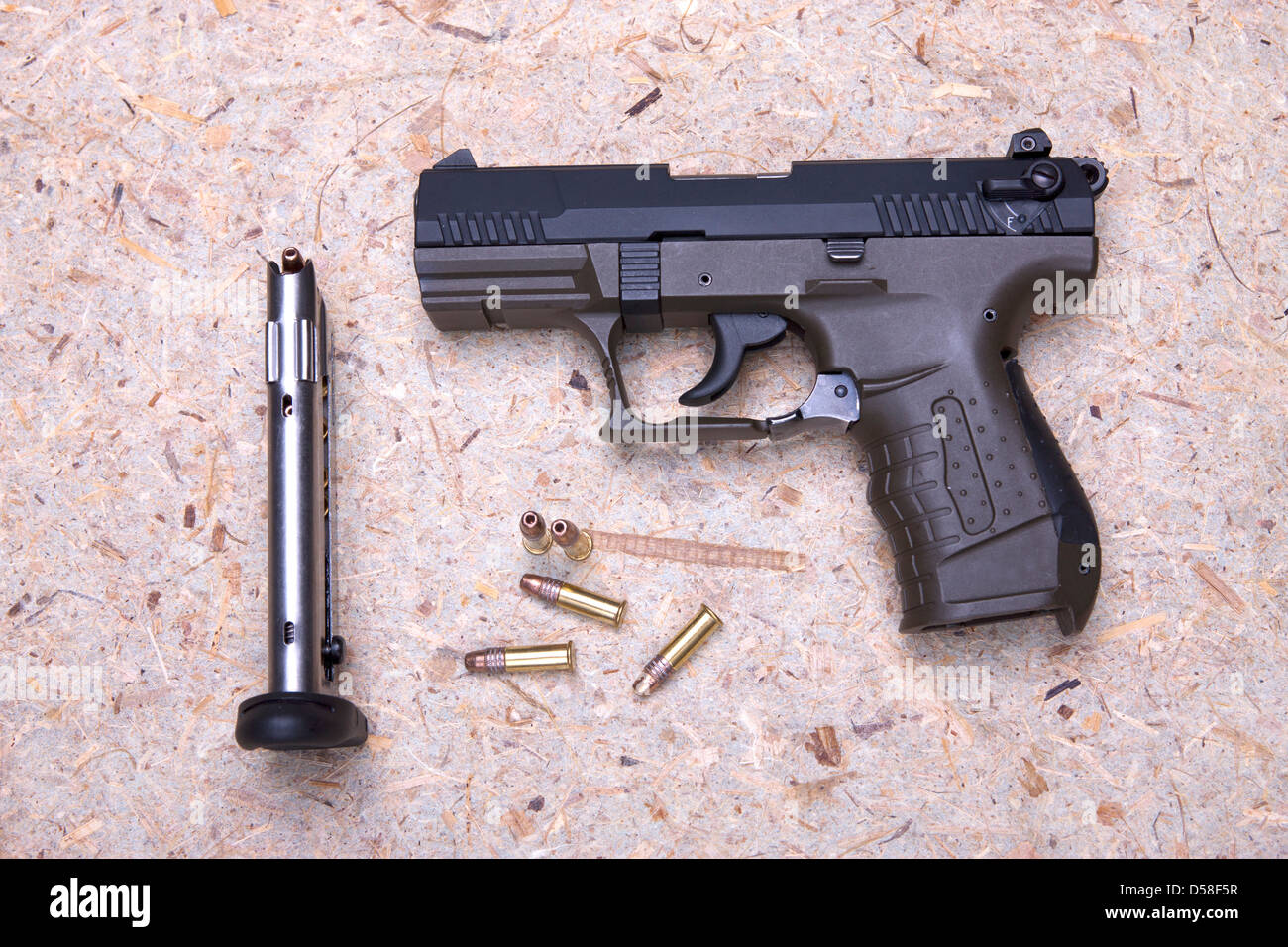 Small pistol with magazine Stock Photo - Alamy