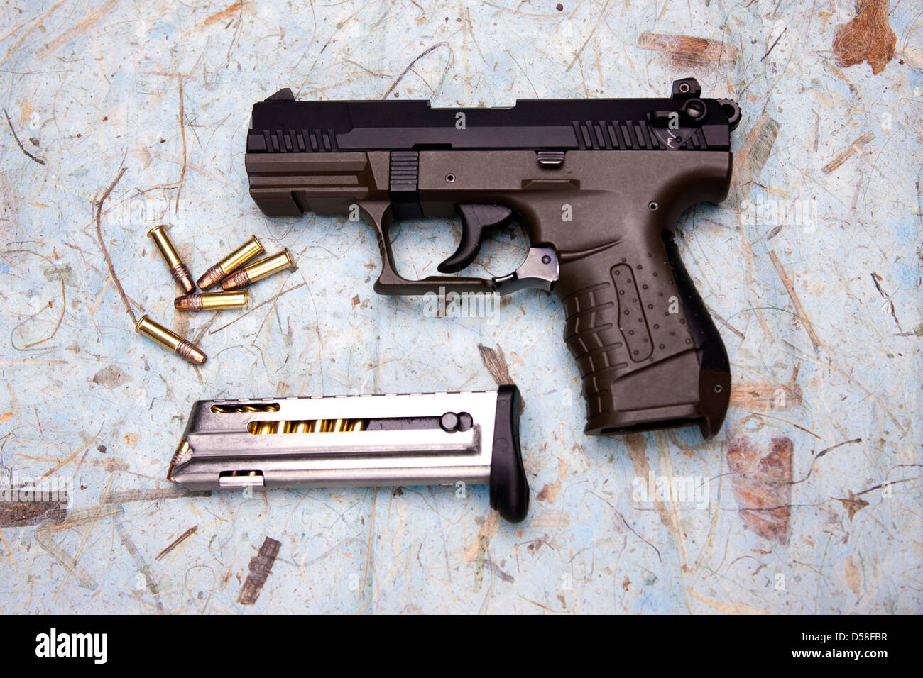 Pistol with bullets and a magazine Stock Photo - Alamy