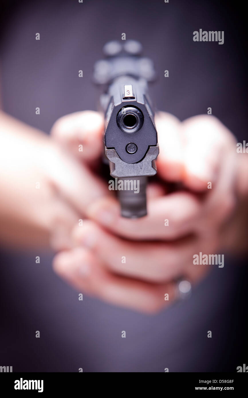 Looking straight at the barrel of a semi automatic pistol Stock Photo ...