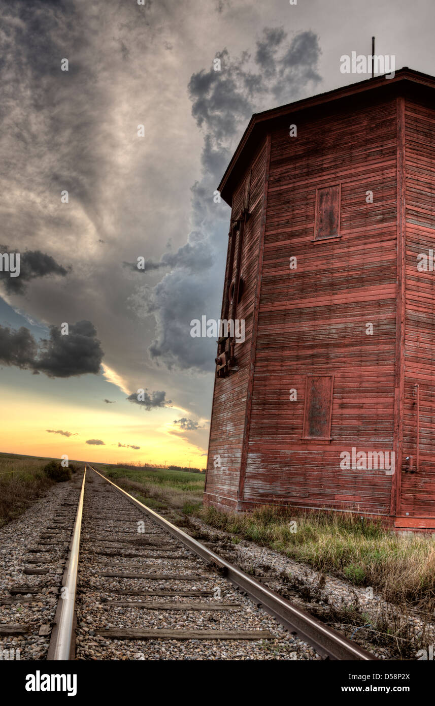 Storm Clouds Saskatchewan with wooden railroad water tower Stock Photo ...
