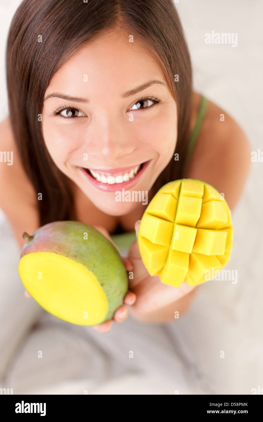 Portrait of happy beautiful Caucasian / Asian young woman showing ...