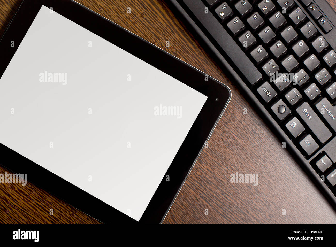 touch tablet and computer keyboard on office table Stock Photo - Alamy